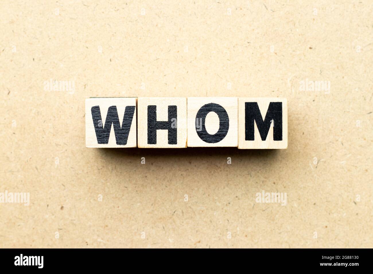 Alphabet letter block in word whom on wood background Stock Photo - Alamy