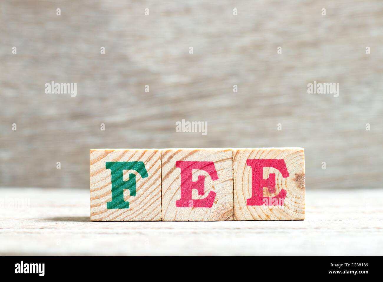 Alphabet letter block in word fee on wood background Stock Photo - Alamy