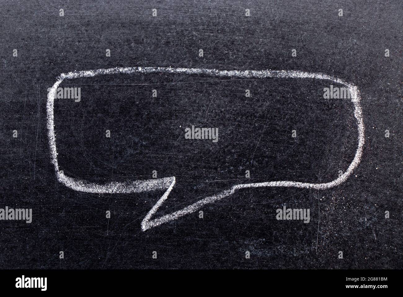 White chalk hand drawing in bubble speech shape with blank space for ...