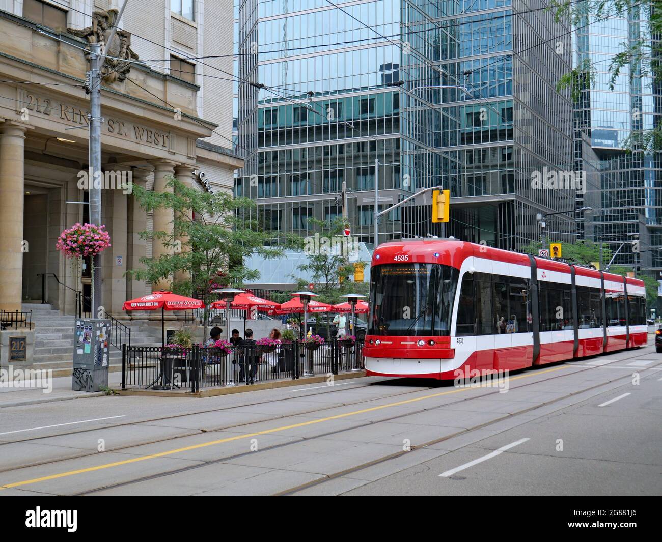 Part of the road is taken over by restaurants on a main street in ...