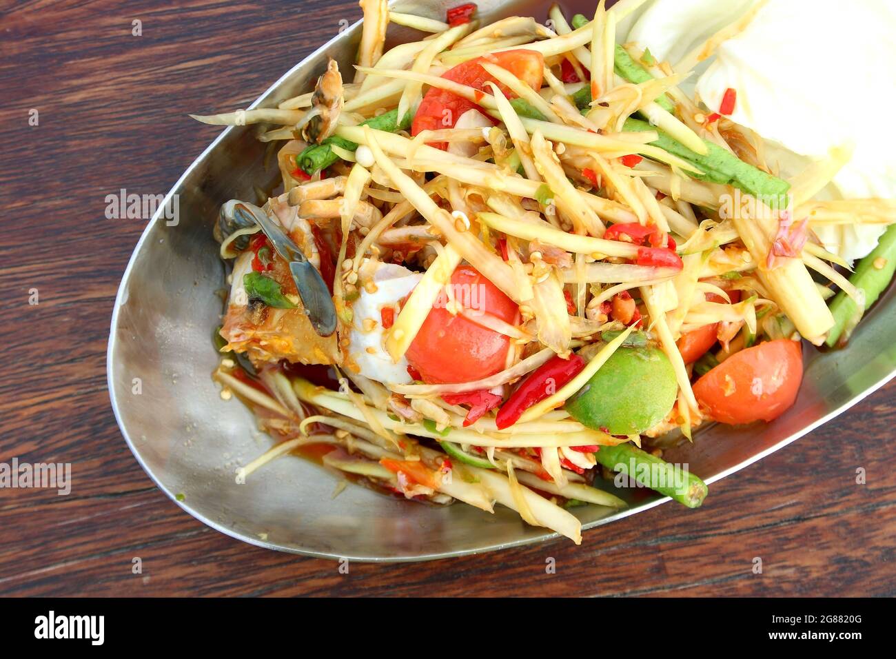 famous Thai food, papaya salad or som-tam on wooden table Stock Photo ...