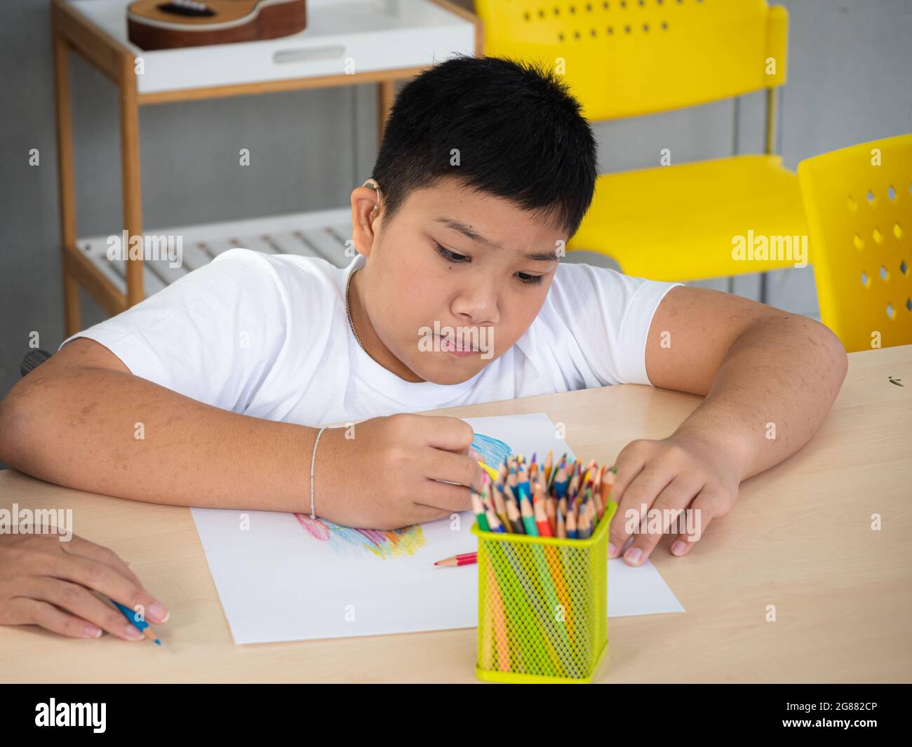 Disabled boy art class hi-res stock photography and images - Alamy