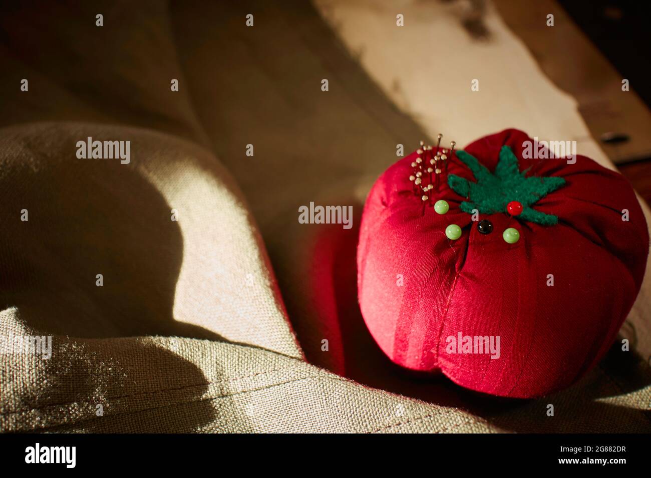 handmade imperfect tomato pincushion with glass head pins on natural ...