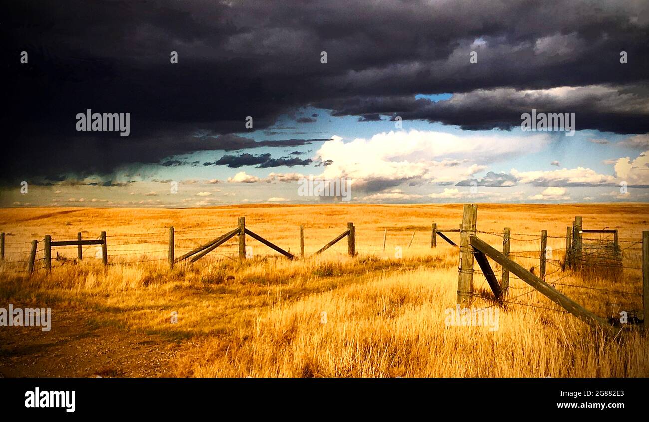 dark clouds over prairie field Stock Photo - Alamy
