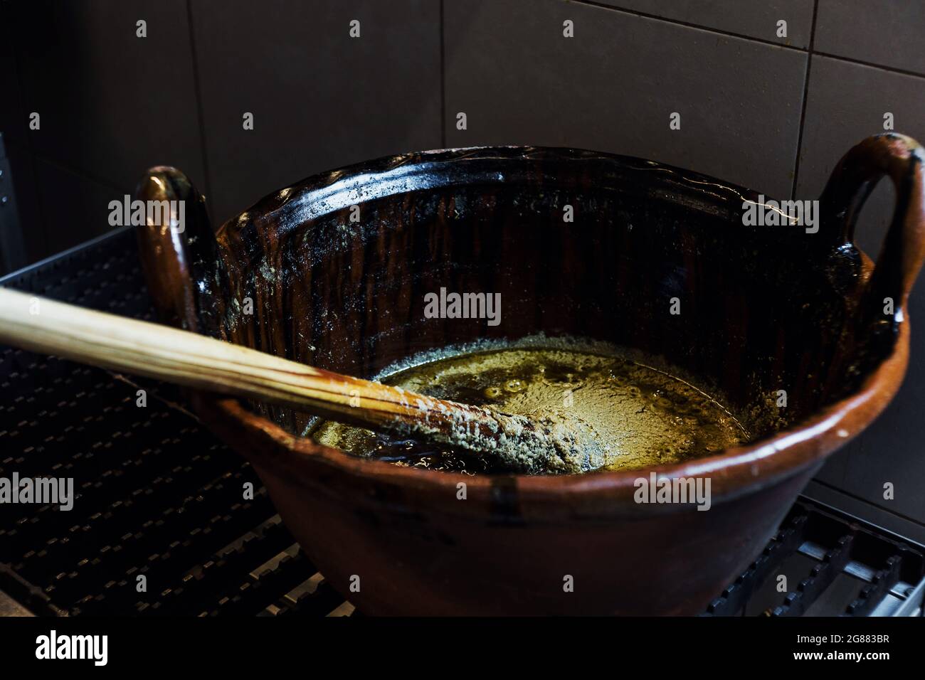 cooking Mexican Mole food in a traditional clay pot in Mexico Stock ...