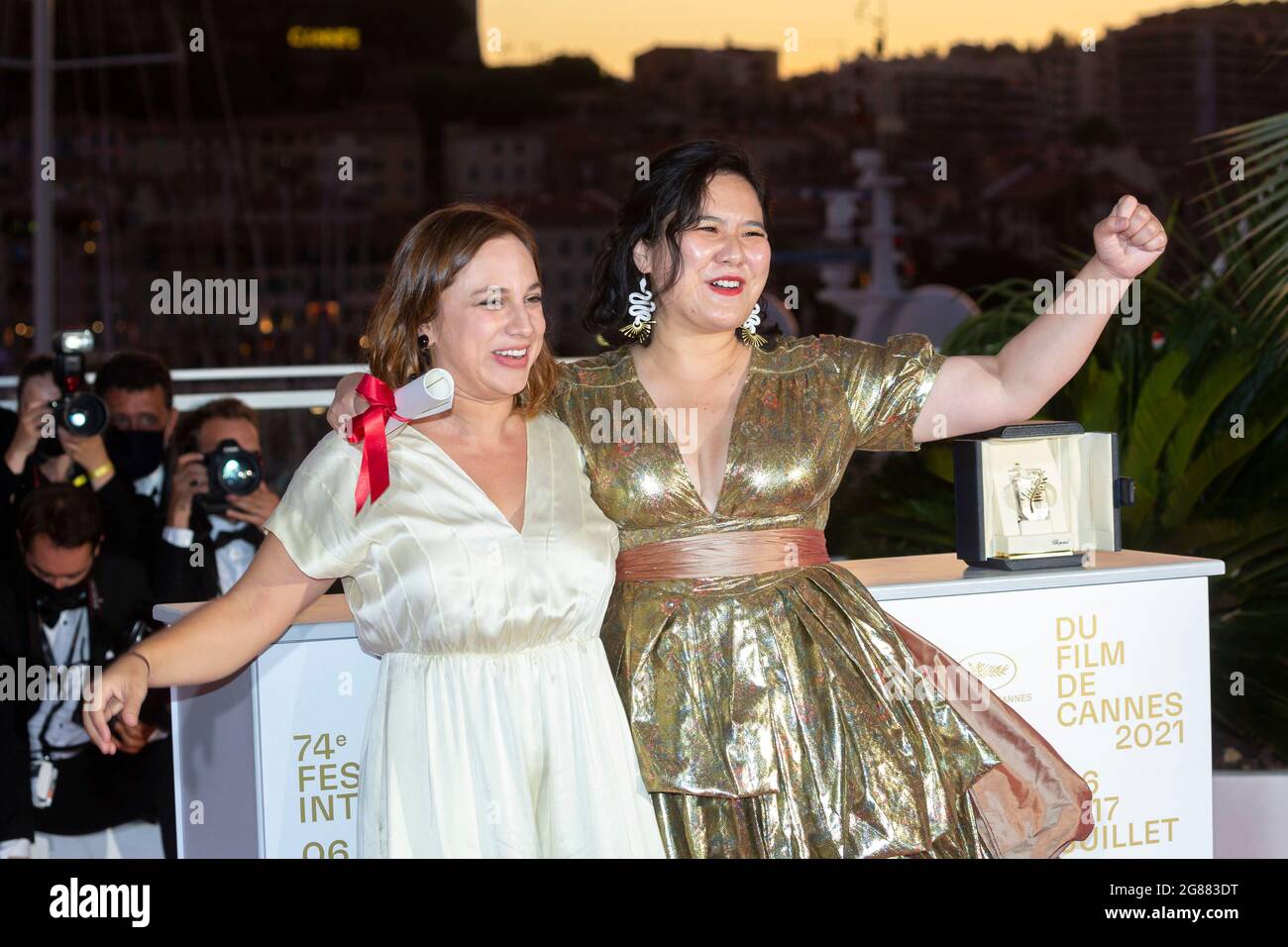 Lasmin Tenucci and Tang Yi (r) pose with the Best Short Movie Award for ...