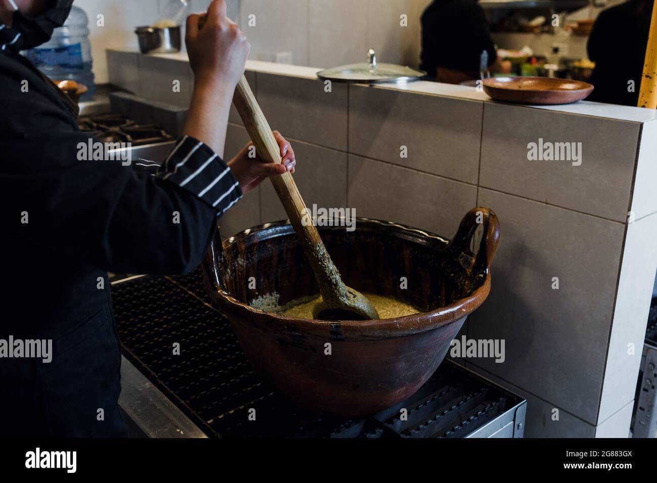 cooking Mexican Mole food in a traditional clay pot in Mexico Stock ...
