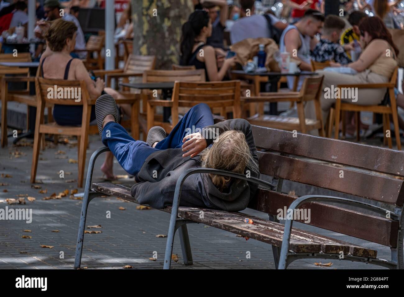 Barcelona, Spain. 11th July, 2021. A homeless person is seen sleeping ...