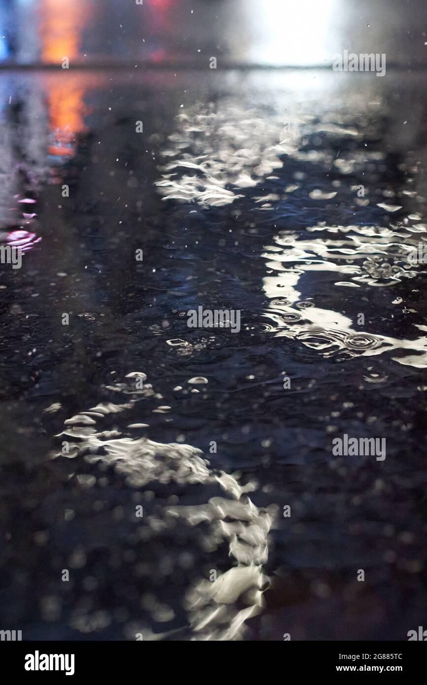 Raindrop on puddle hi-res stock photography and images - Alamy