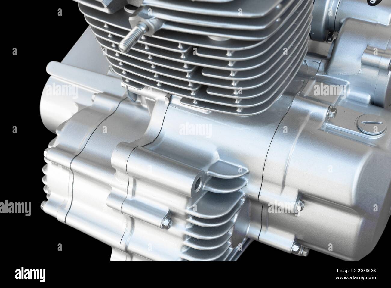 Part of motorcycle engine isolated on black background. Air cooled ...