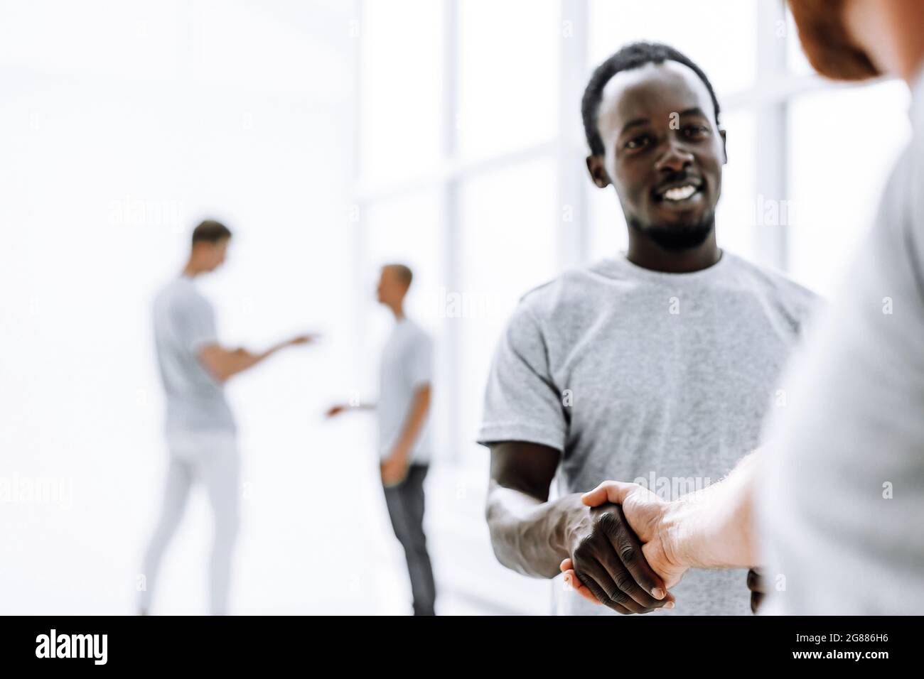 close up. friendly handshake of young people Stock Photo - Alamy