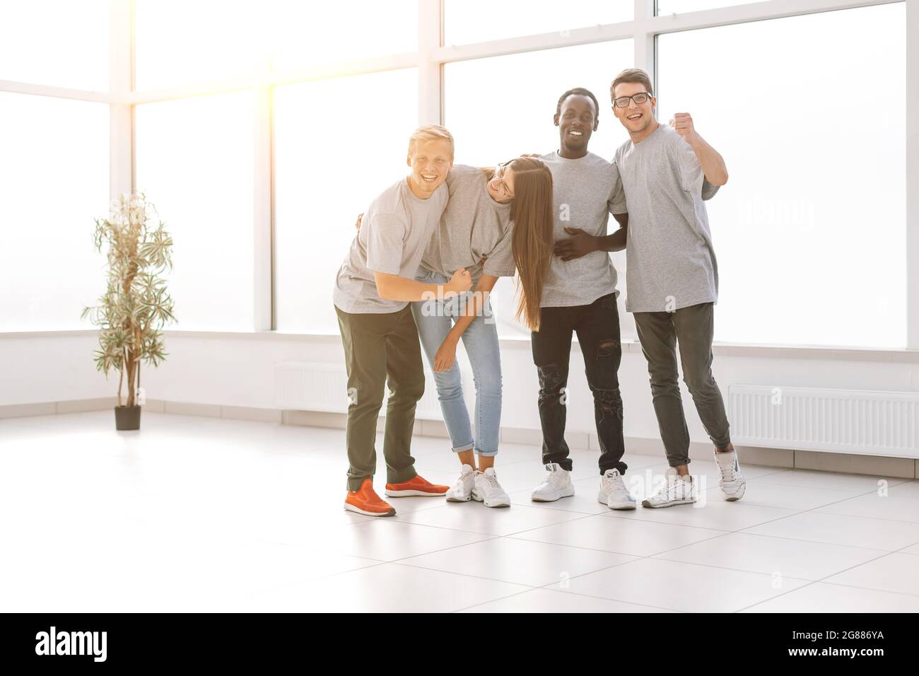 Team young people standing hi-res stock photography and images - Alamy