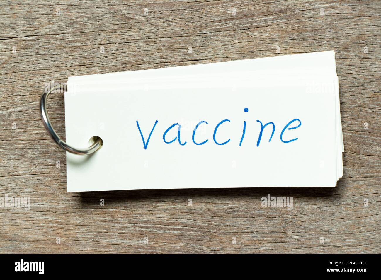 Flash card with handwriting word vaccine on wood background Stock Photo ...