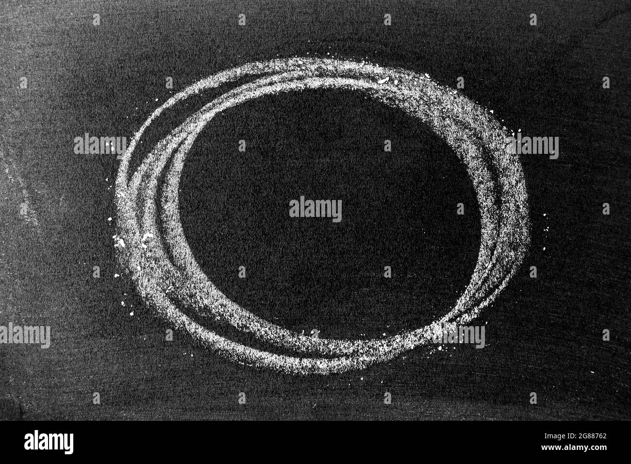 White chalk hand drawing as circle shape on blackboard or chalkboard ...