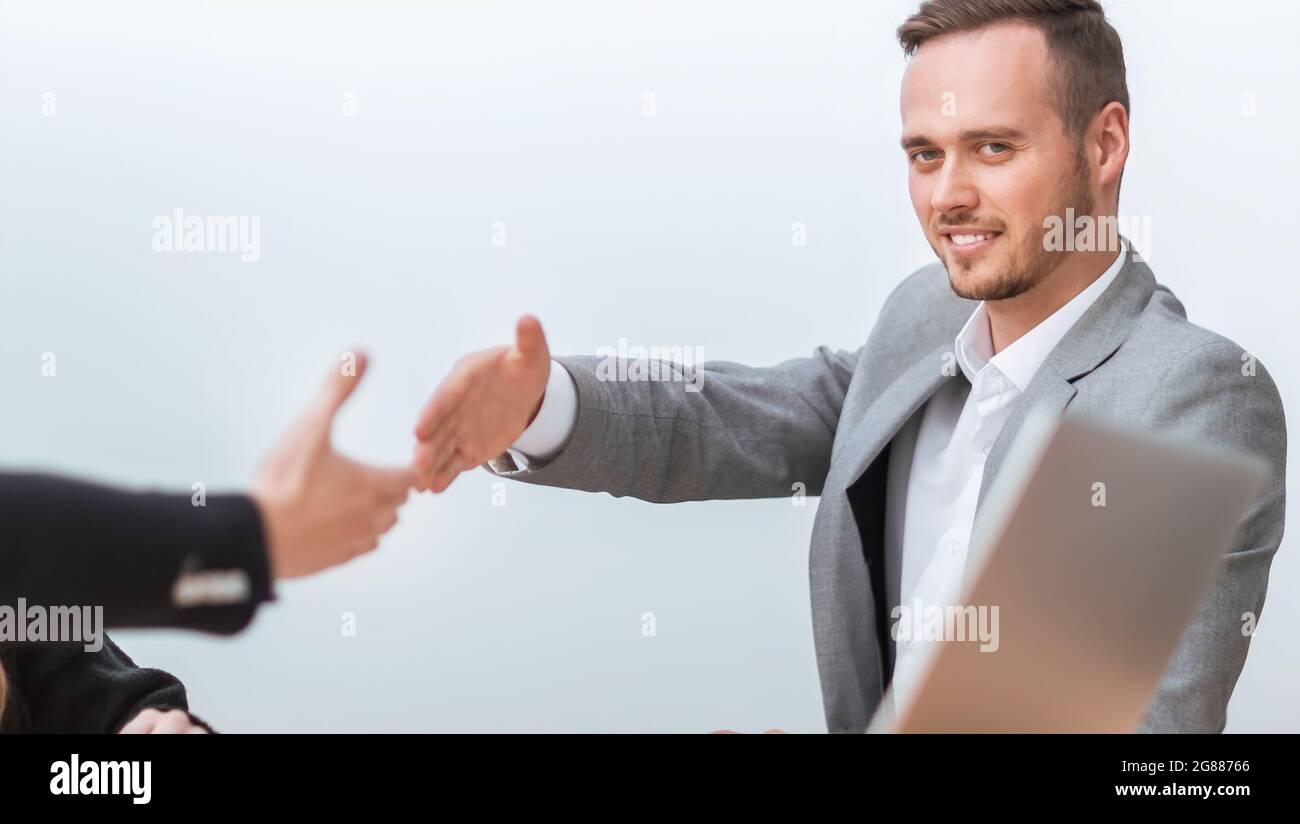 business people holding out their hands for a handshake Stock Photo - Alamy