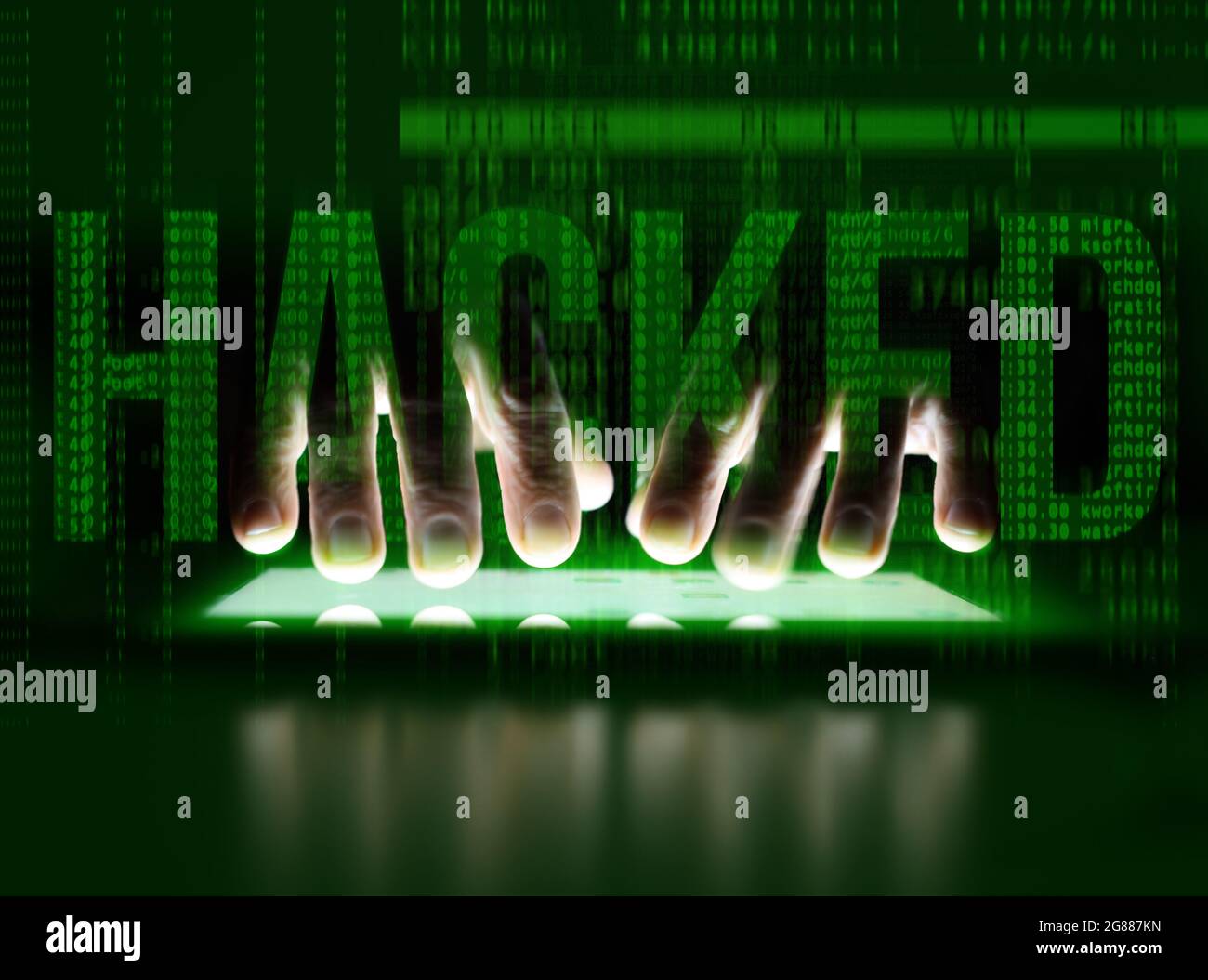 Hacker using computer on dark background Stock Photo - Alamy