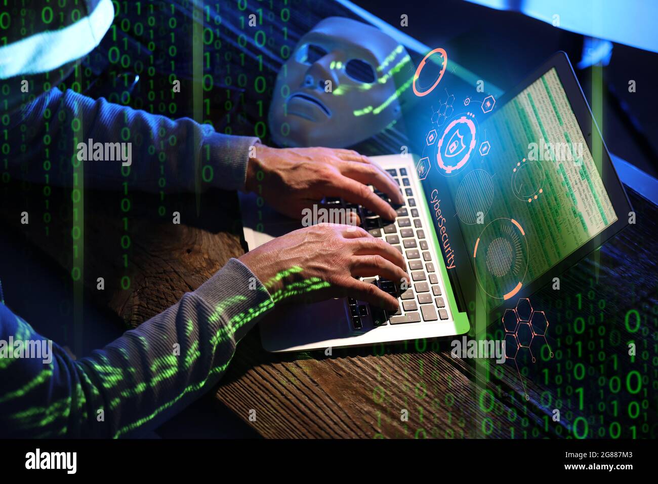 Hacker using computer in dark room Stock Photo - Alamy