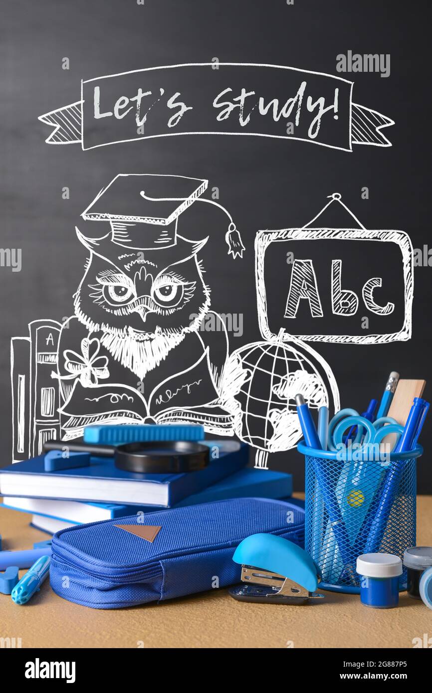 Set of school supplies in classroom Stock Photo - Alamy