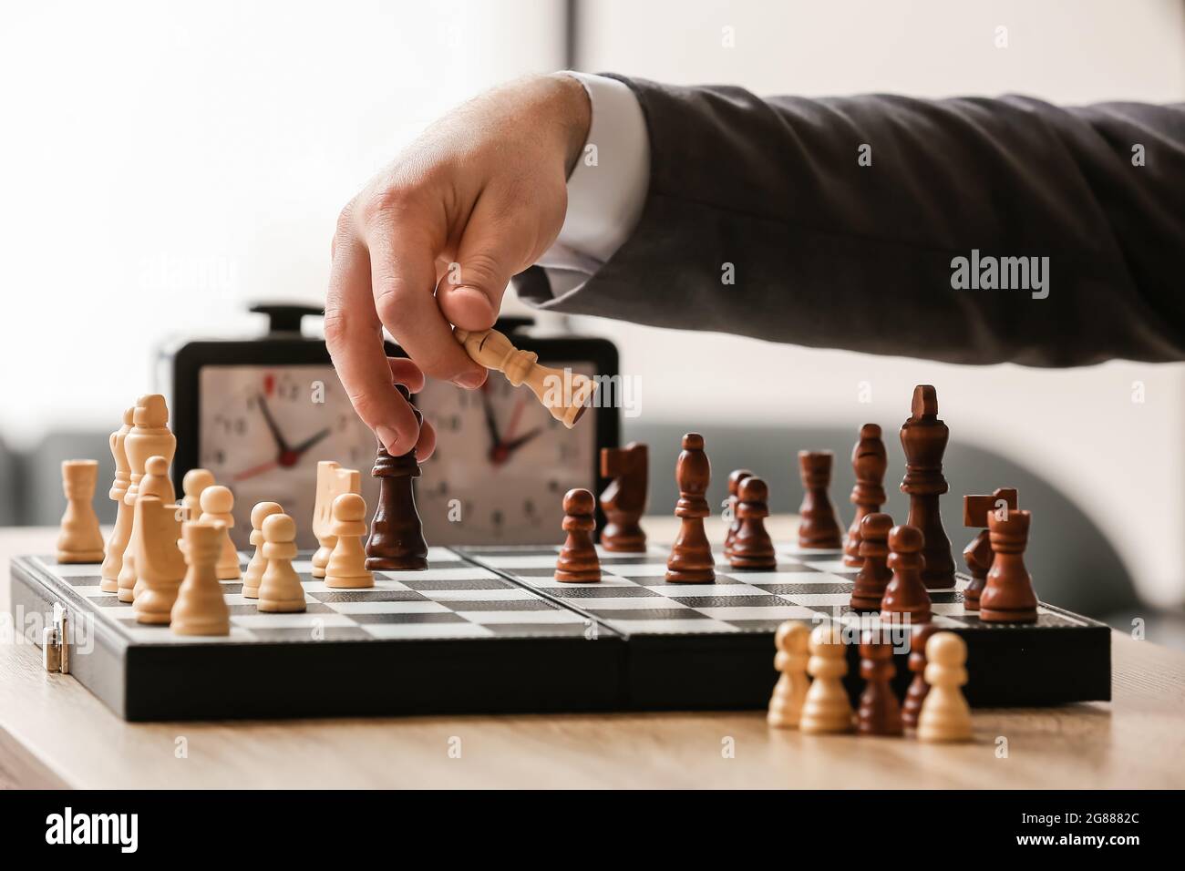 Wooden chess pieces clock hi-res stock photography and images - Alamy
