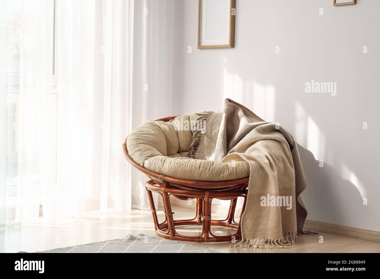 Interior of stylish living room with armchair Stock Photo - Alamy