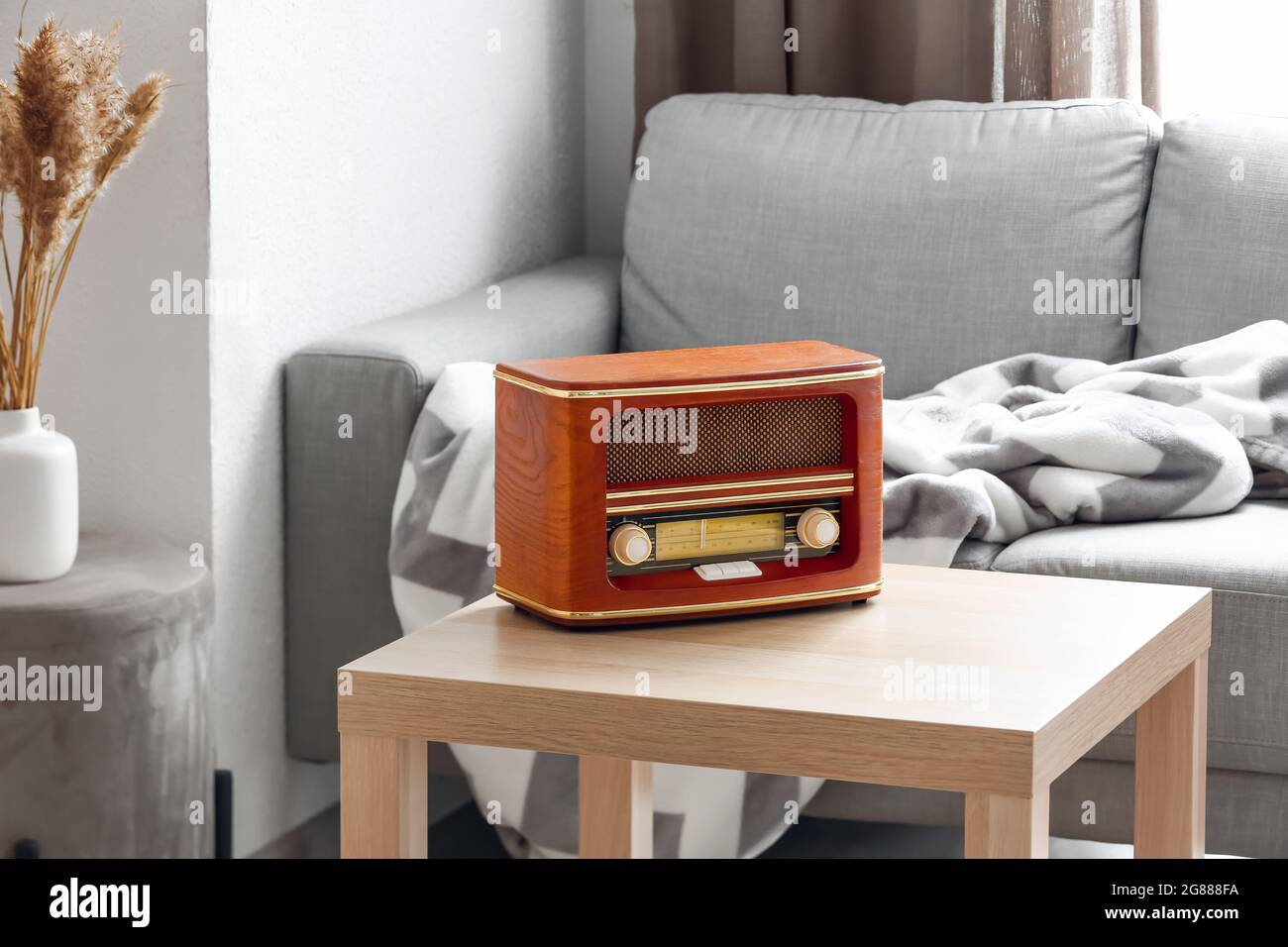 Retro radio receiver on table in living room Stock Photo - Alamy