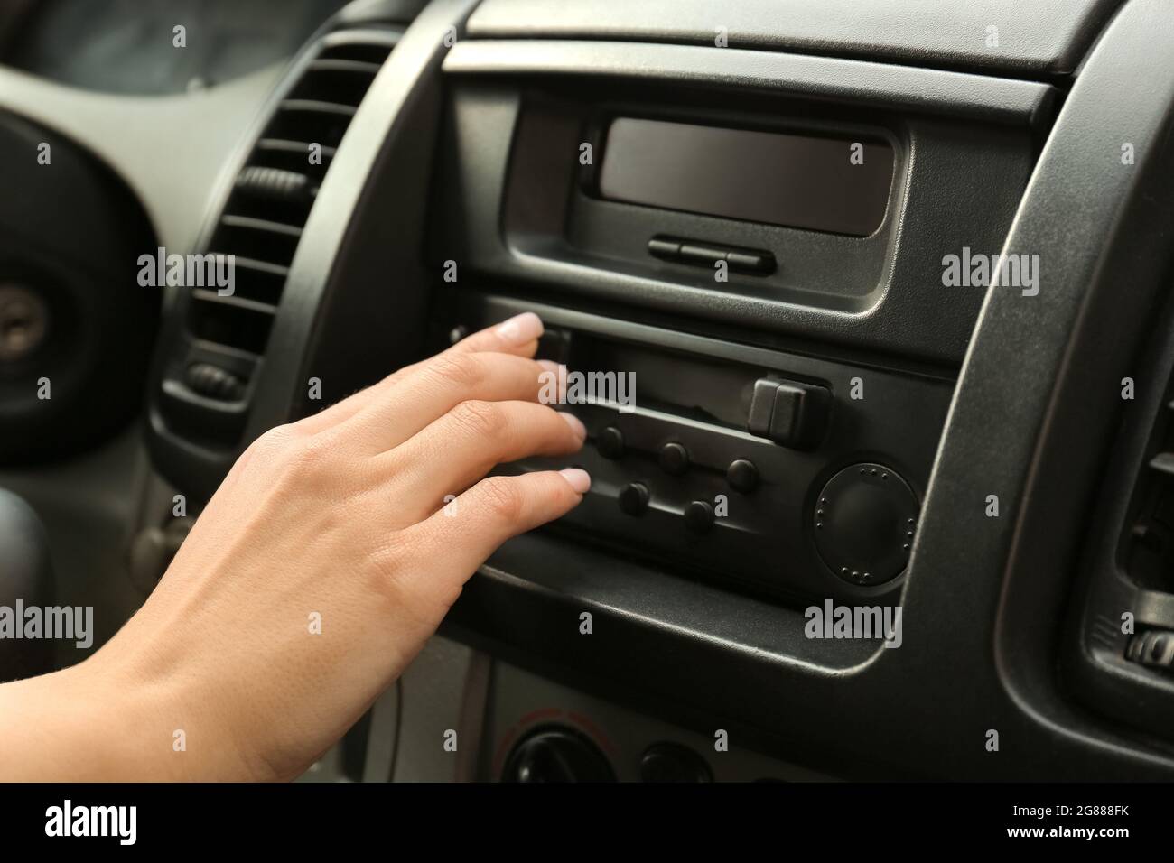 Woman tuning radio hi-res stock photography and images - Alamy