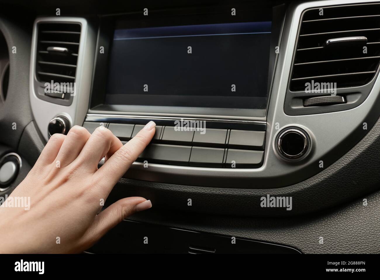 Woman tuning radio in car, closeup Stock Photo - Alamy