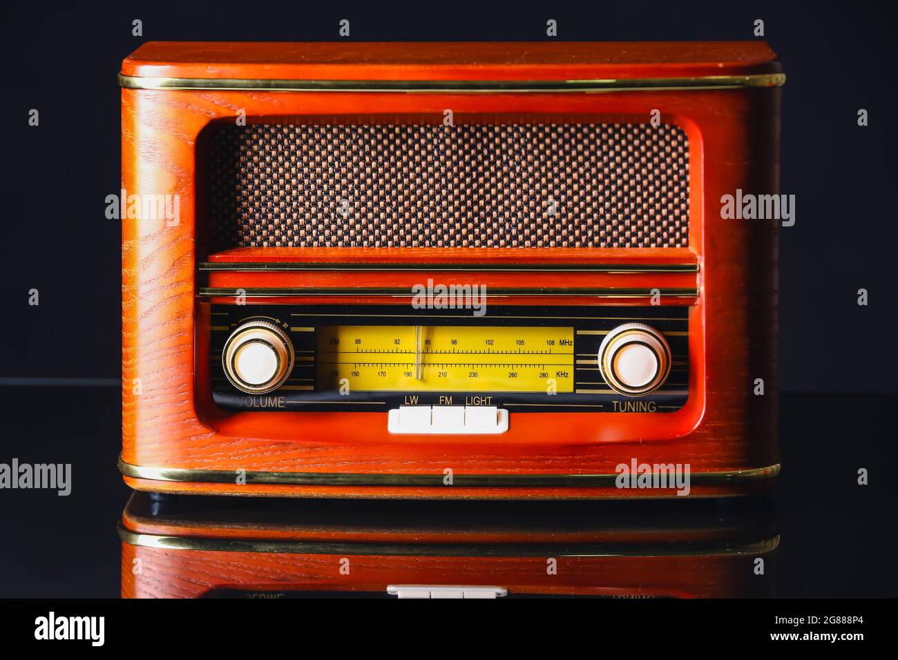 Retro radio receiver on dark background Stock Photo - Alamy