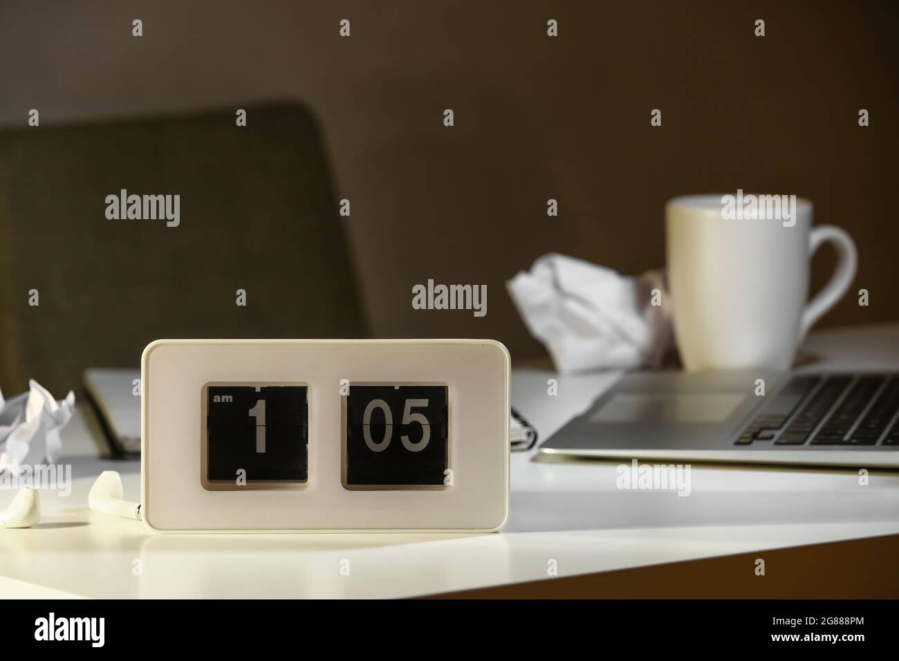 Alarm clock on table in room at night Stock Photo - Alamy