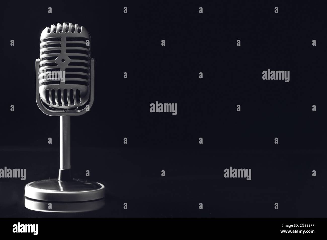 Retro microphone on dark background Stock Photo - Alamy