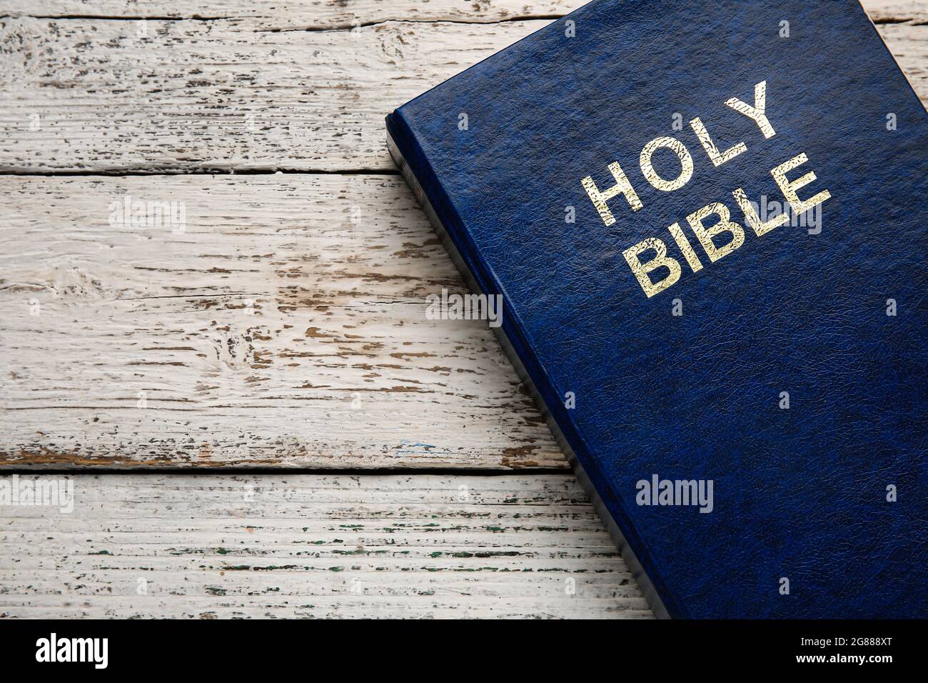 Holy Bible on light wooden background Stock Photo - Alamy