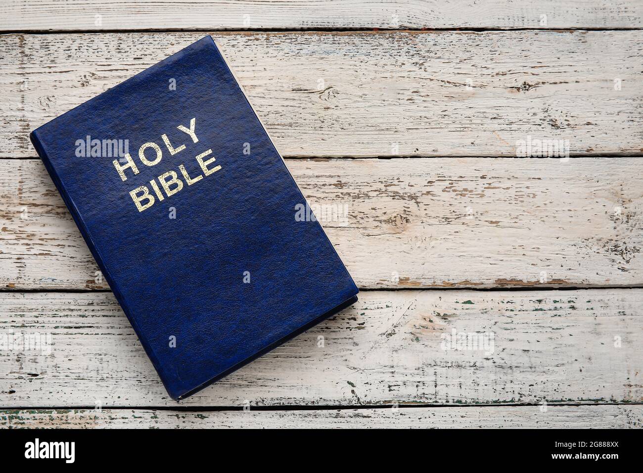 Holy Bible on light wooden background Stock Photo - Alamy