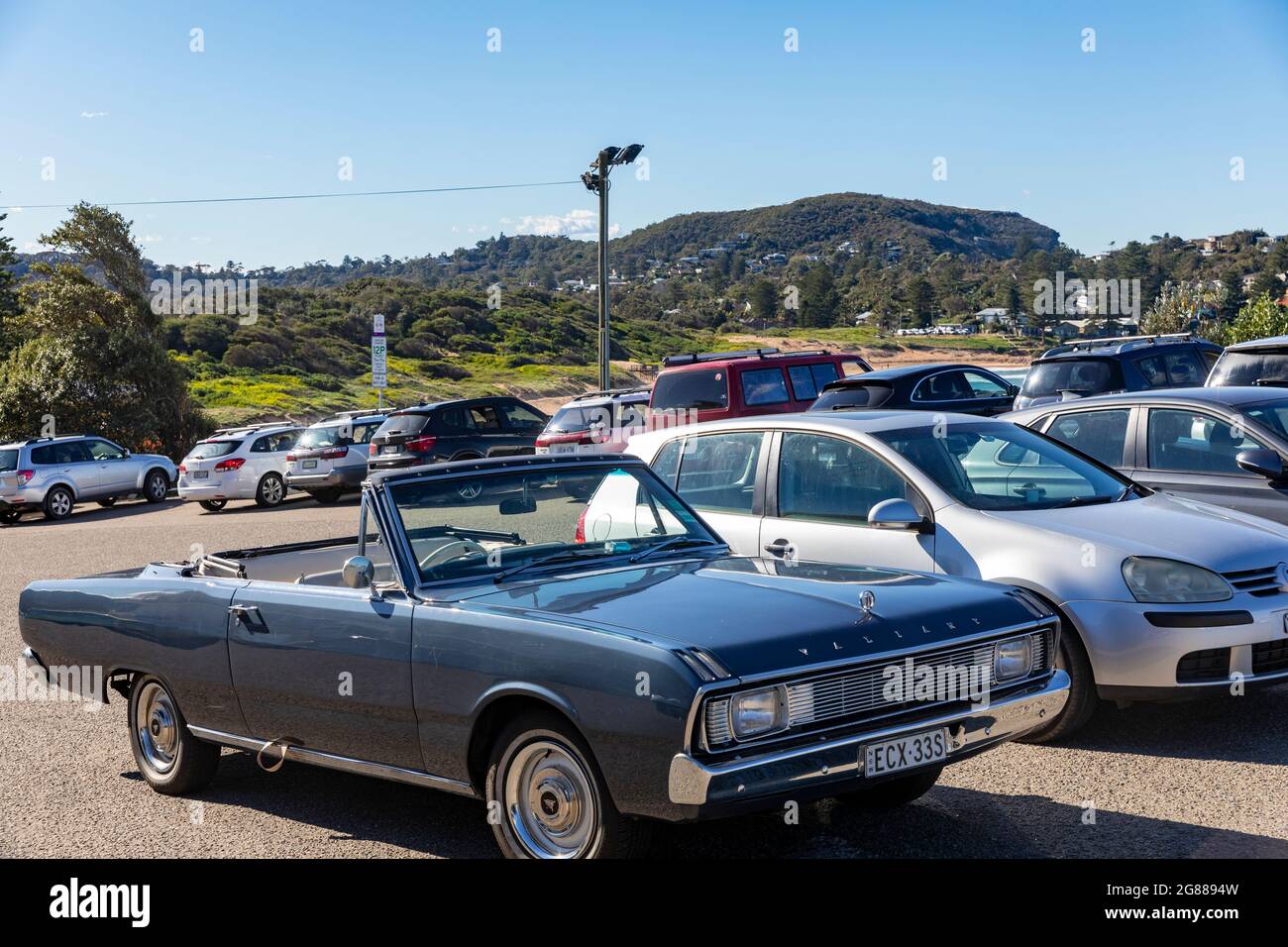 1970 Chrysler valiant classic soft top car parked at a Sydney beach in ...