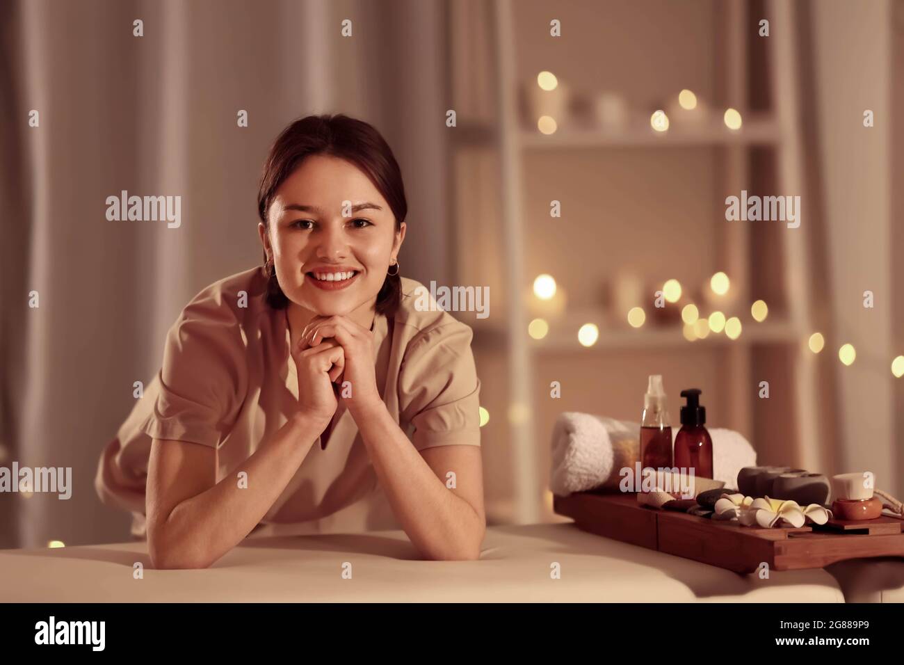 Female massage therapist in spa salon Stock Photo - Alamy
