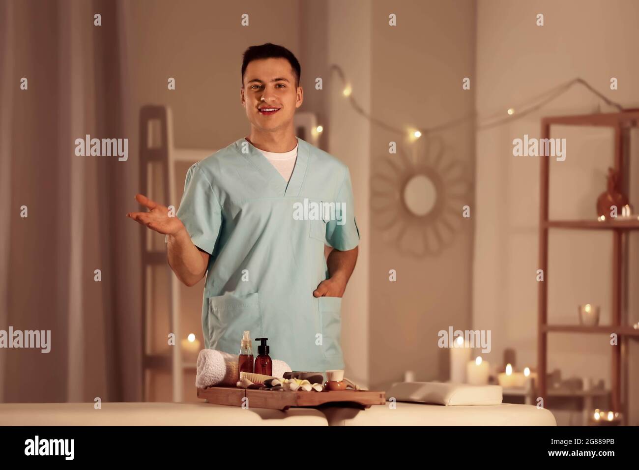 Male massage therapist in spa salon Stock Photo - Alamy