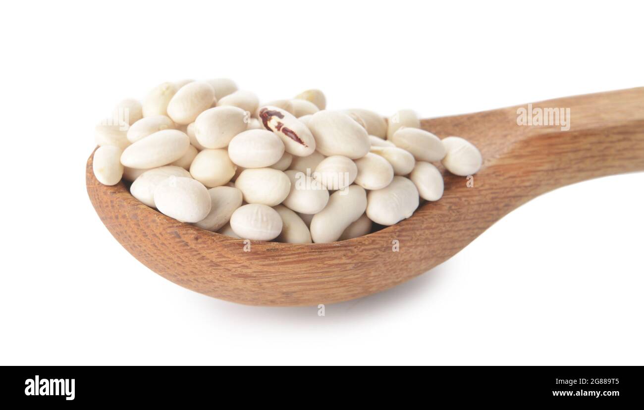 Spoon with raw beans on white background Stock Photo - Alamy
