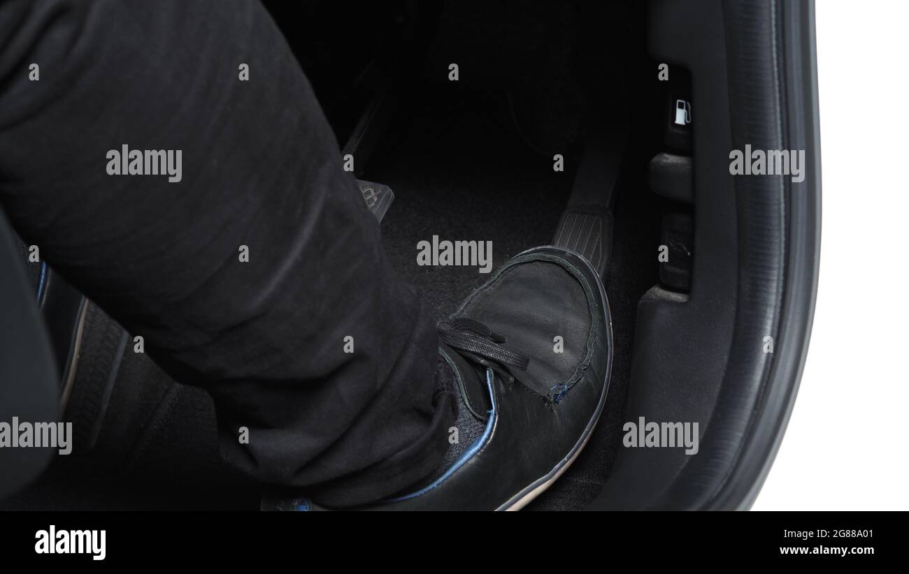 Man foot and accelerator and brake pedal inside the car or vehicle and ...