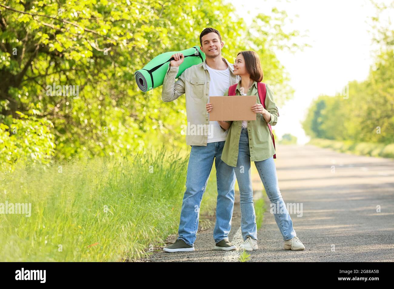 Hitchhiking together hi-res stock photography and images - Alamy