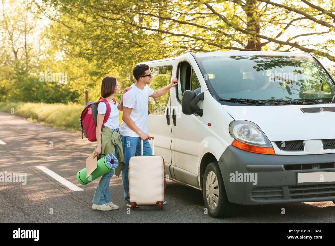 Hitchhiking together hi-res stock photography and images - Alamy