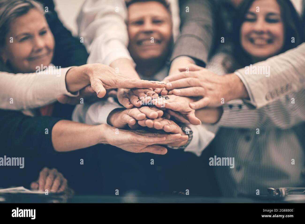 group of diverse business people showing their unity Stock Photo - Alamy