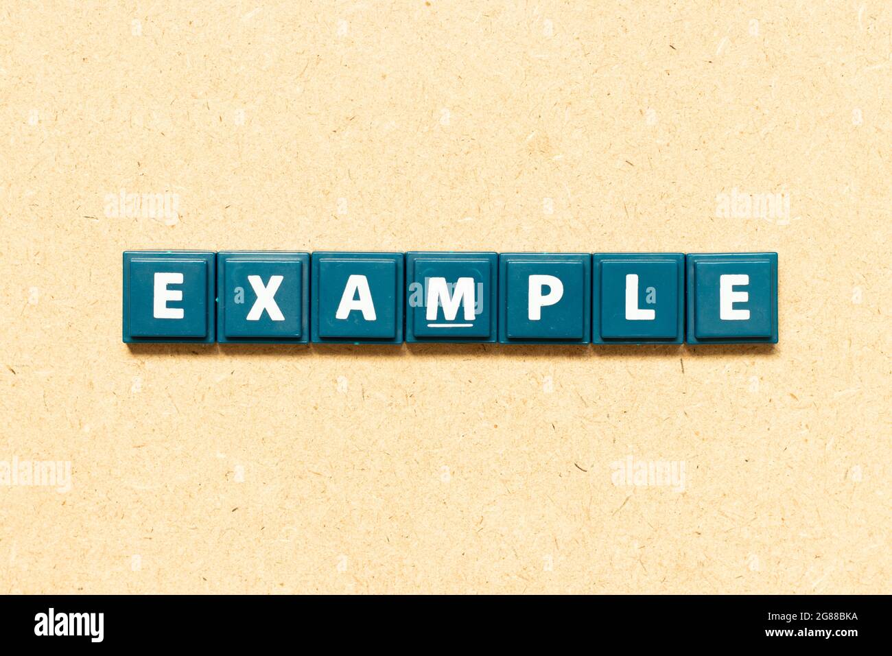 Tile alphabet letter in word example on wood background Stock Photo - Alamy
