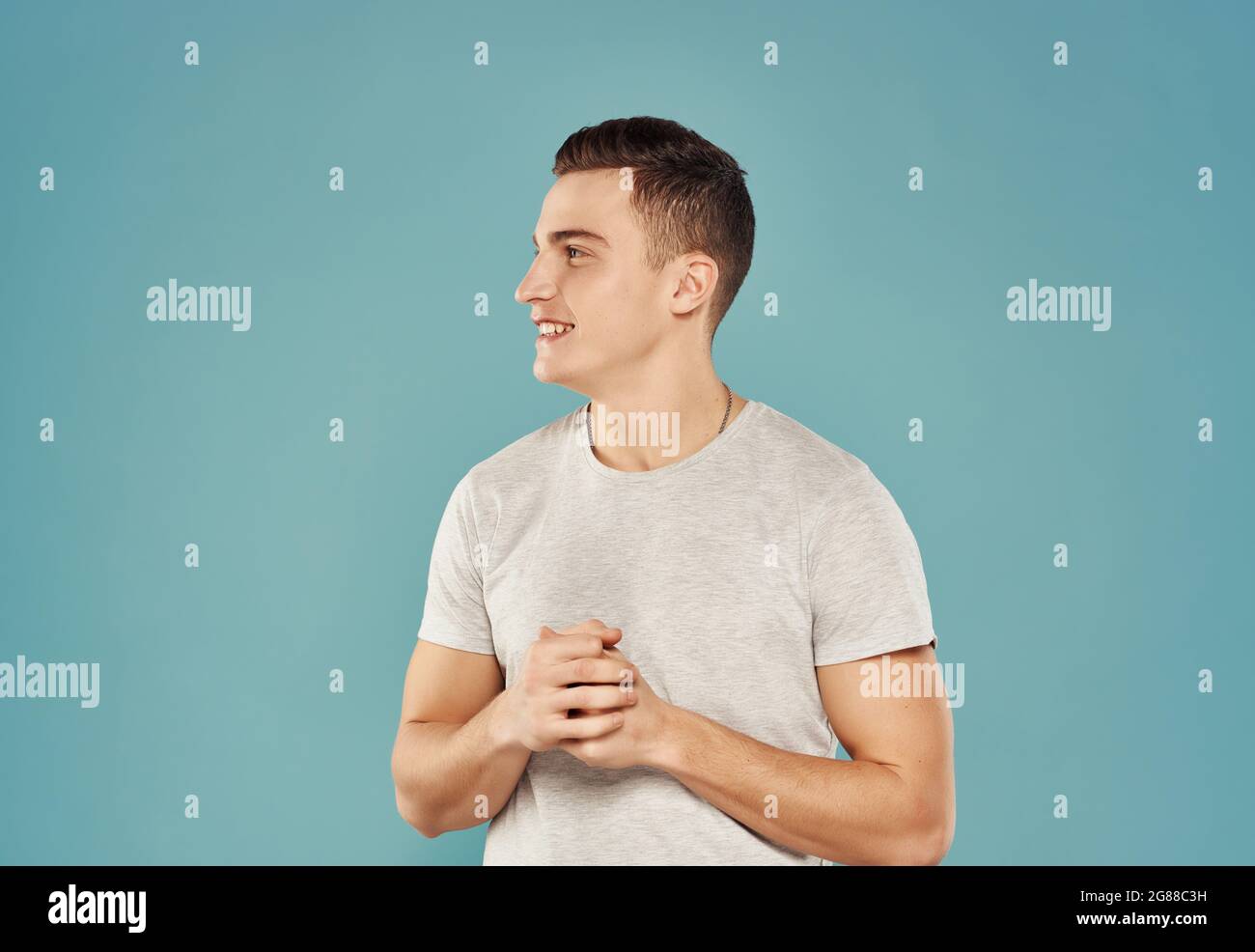 cute emotional man smile emotion blue background Stock Photo - Alamy