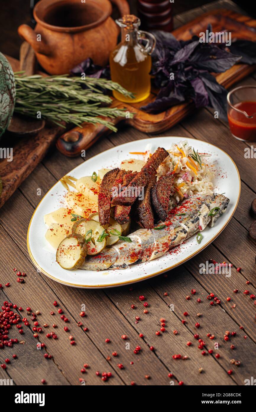Traditional russian snacks with herring and pickle Stock Photo - Alamy