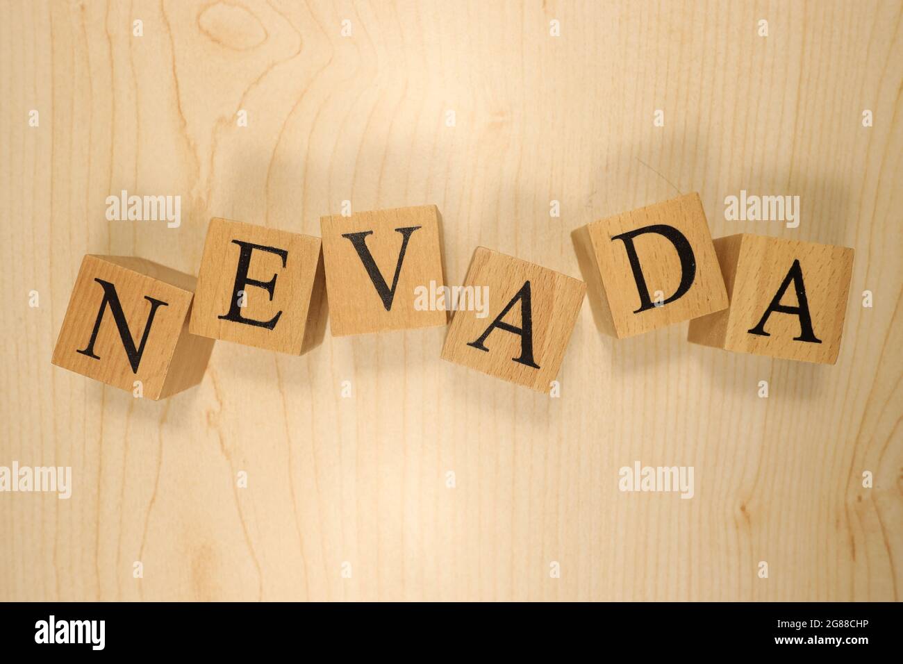 The word Nevada was created from wooden letter cubes. Cities and words ...