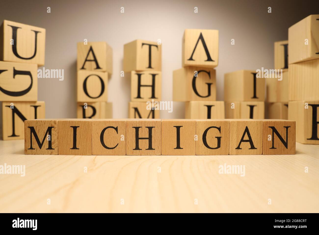 The word Michigan was created from wooden letter cubes. Cities and ...