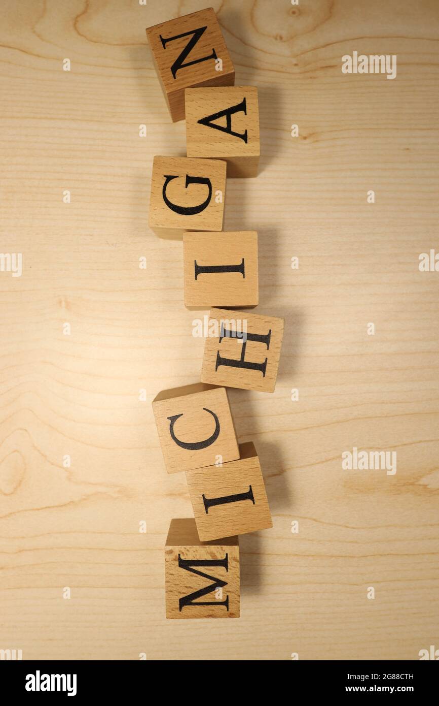 The word Michigan was created from wooden letter cubes. Cities and ...
