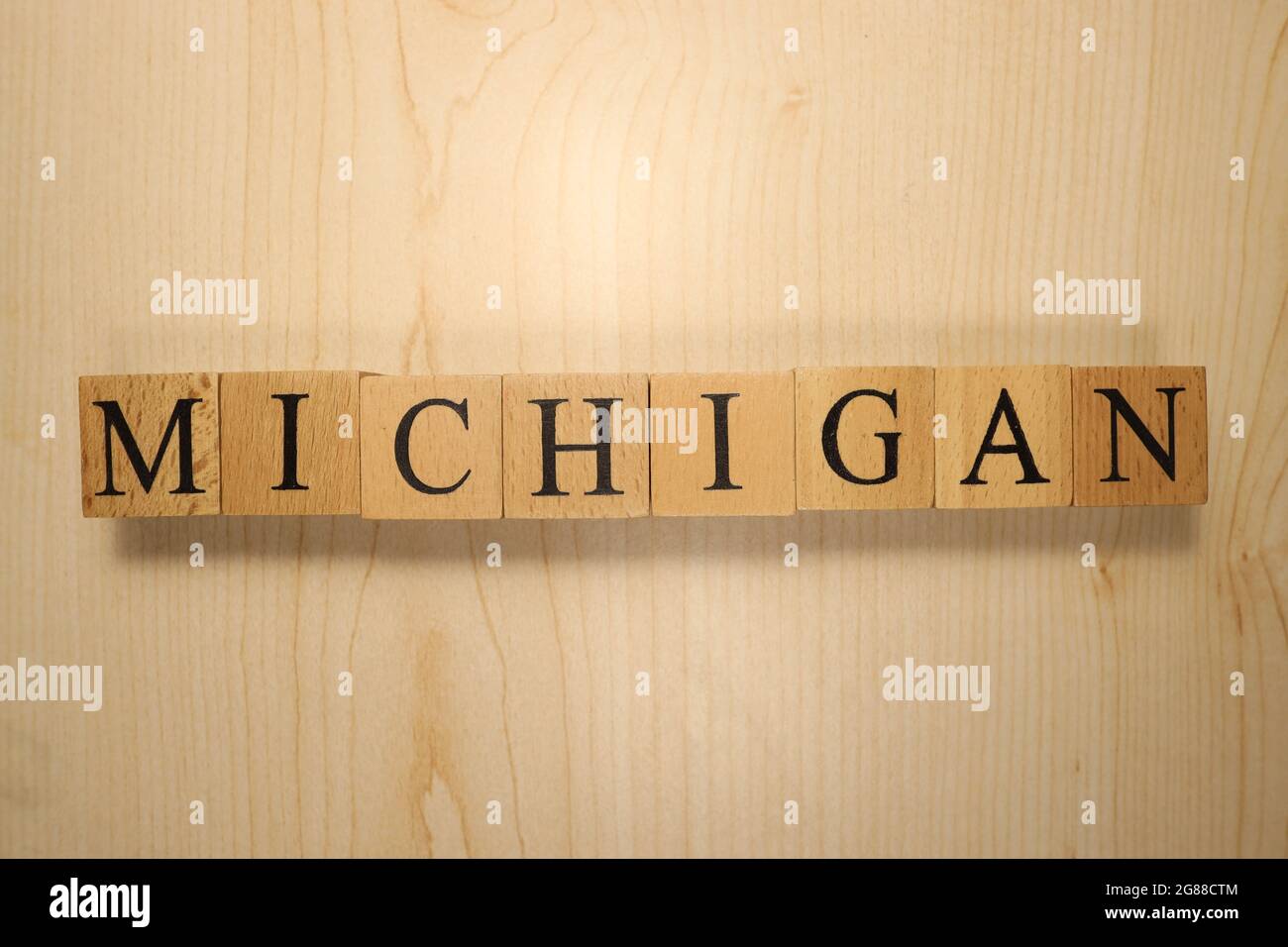 The word Michigan was created from wooden letter cubes. Cities and ...