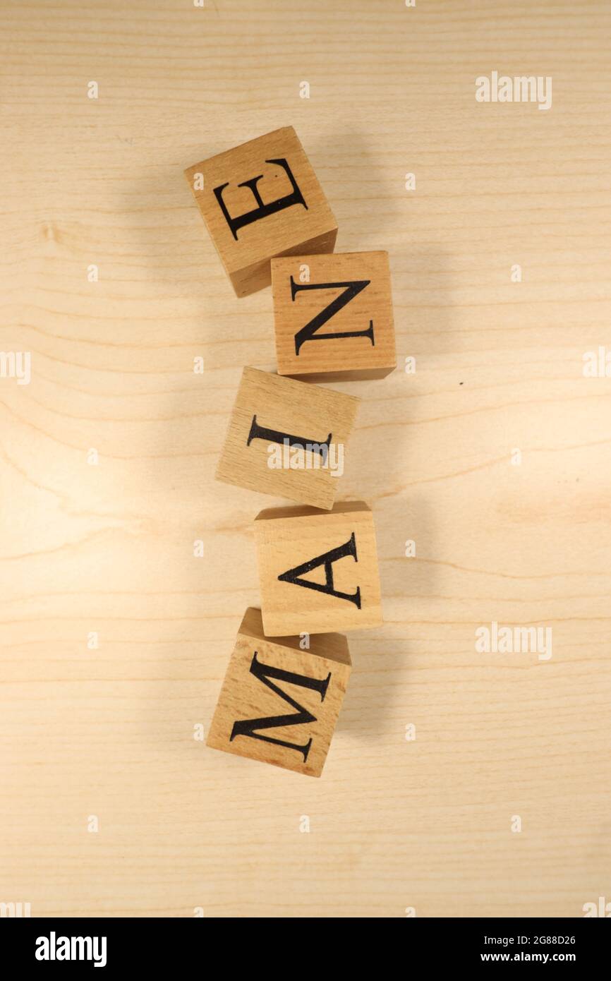 The word Maine was created from wooden letter cubes. Cities and words ...