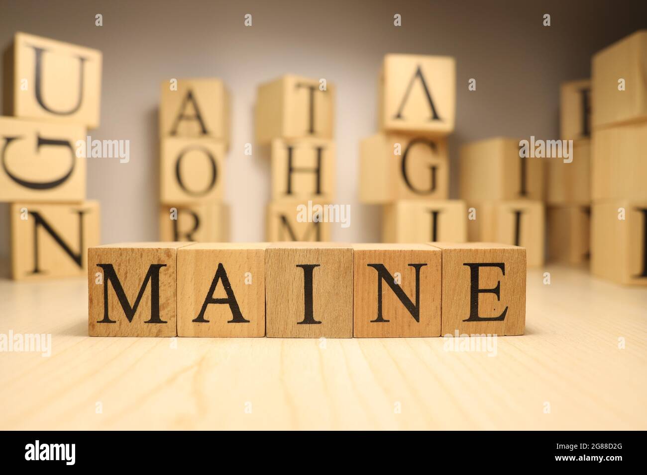 The word Maine was created from wooden letter cubes. Cities and words ...