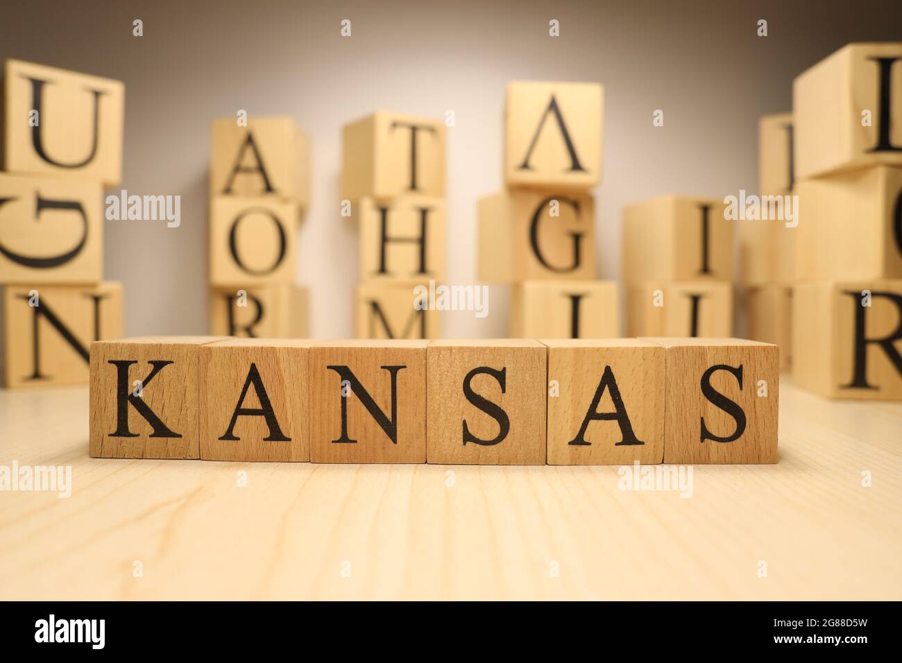 The word Kansas was created from wooden letter cubes. Cities and words ...
